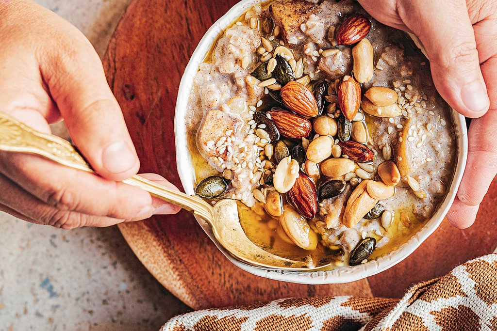Apple pie porridge with ghee-toasted nuts