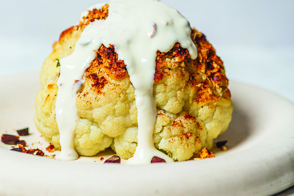 Cheesy roast cauliflower with crunchy almond topping recipe - Spinneys ...