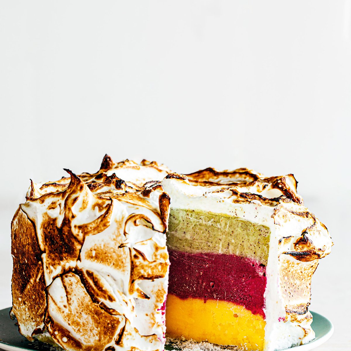 Rainbow sorbet cake with torched coconut meringue recipe - Spinneys UAE