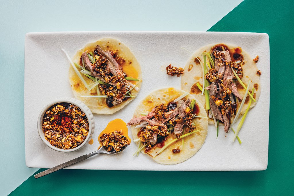 Crispy duck skin and chilli crunch on pancakes recipe - Spinneys United ...